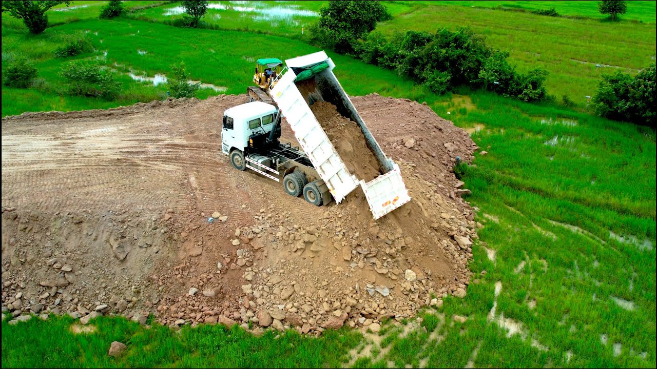 Excellent techniques komatsu dozer pushing stone | dump truck unloading ...