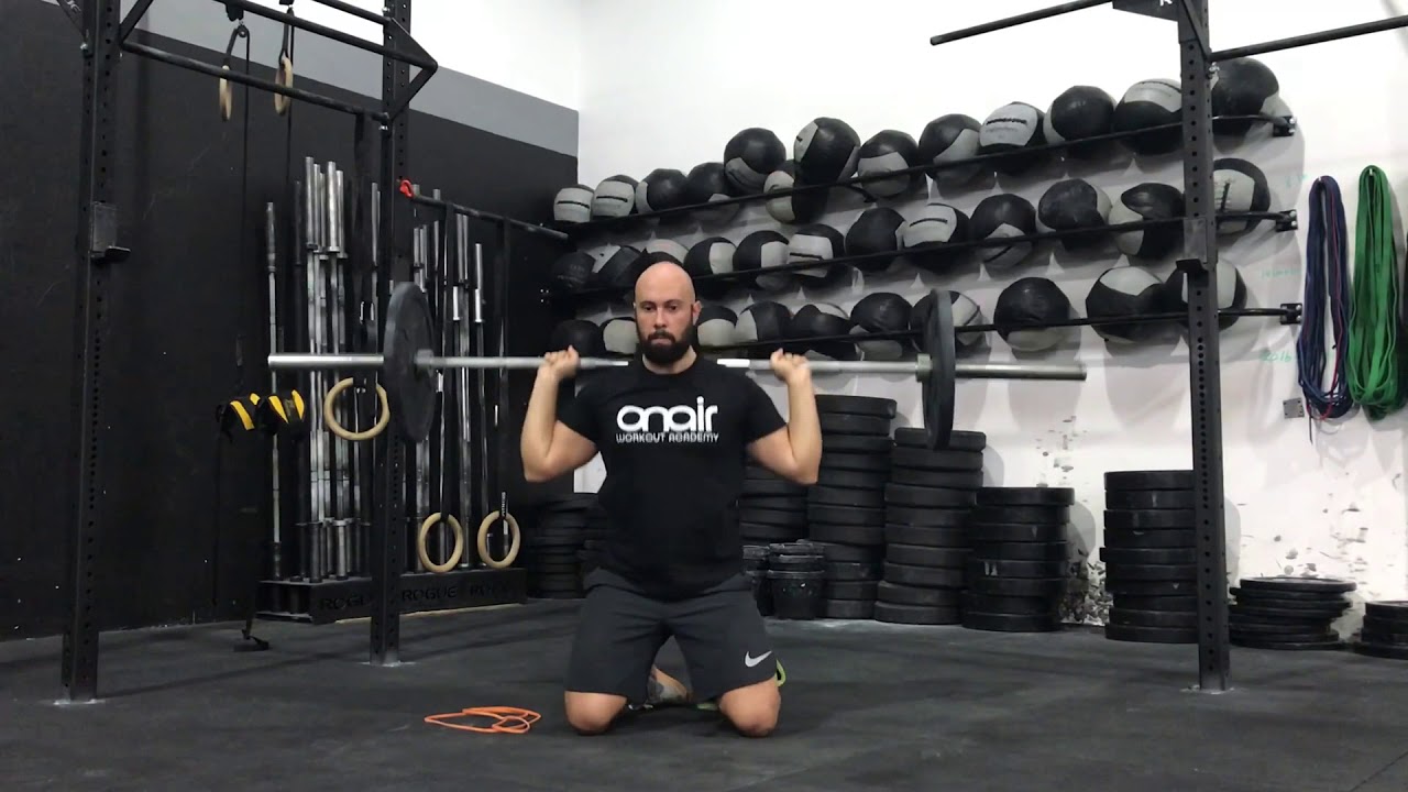 Functional Strength - Tall Kneeling Barbell Push Press Behind the Neck ...