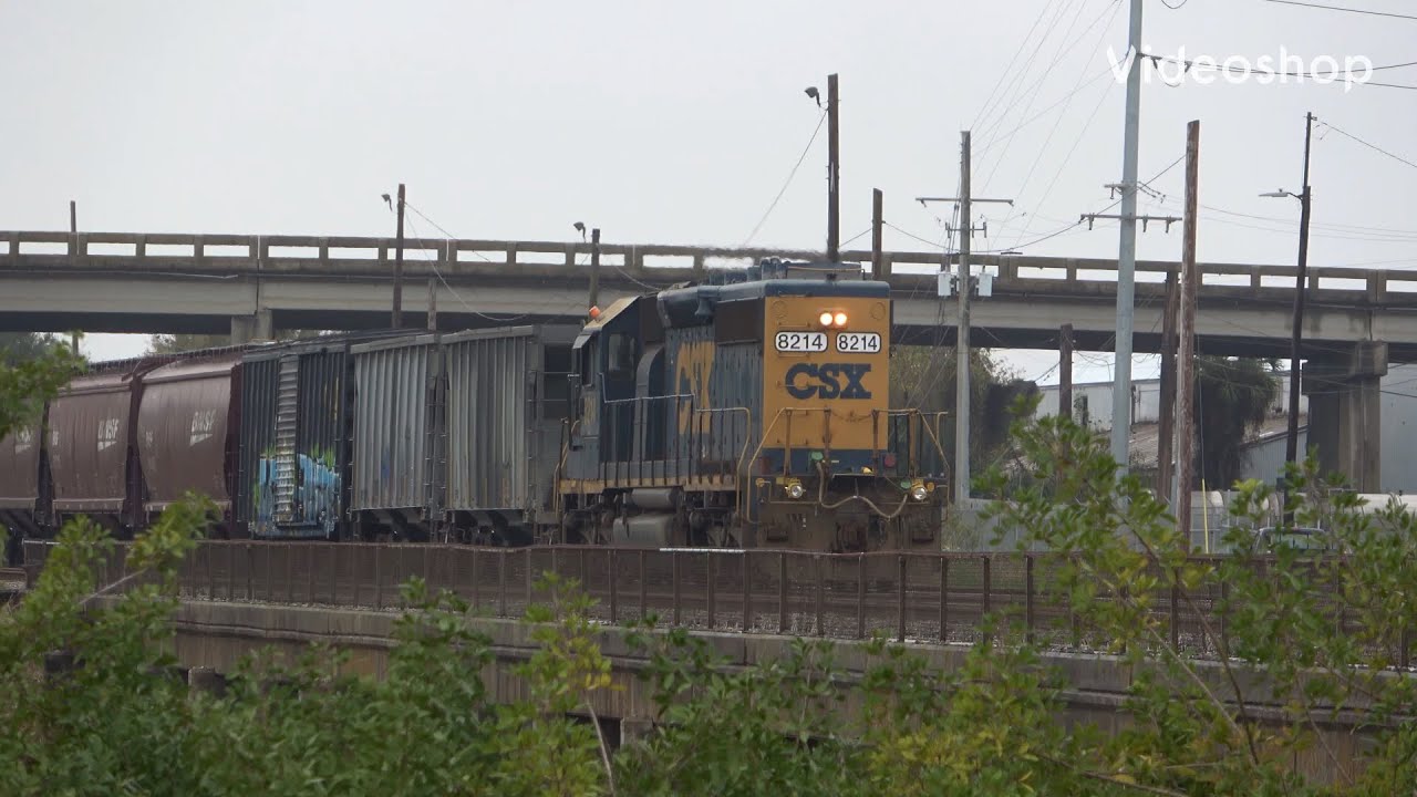 Remote control CSX locomotive 8214 building a train, and a highrail ...