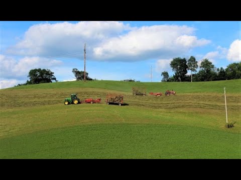 How a Square Baler Works l Baling Hay on a Small Dairy Farm - YouTube