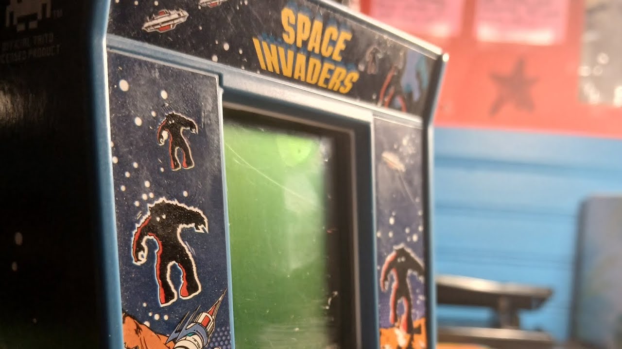 Starting up a comically small arcade machine. - YouTube