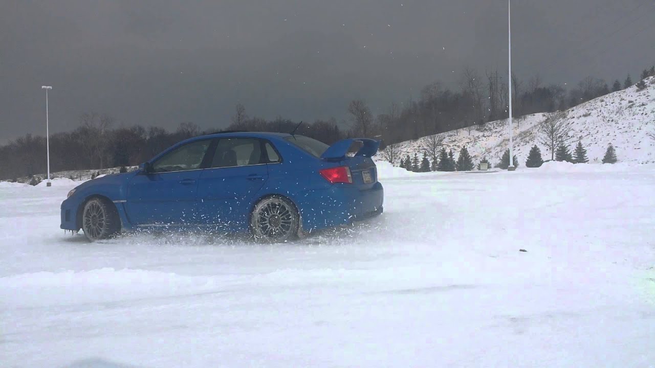 2014 subaru sti donuts in the snow - YouTube