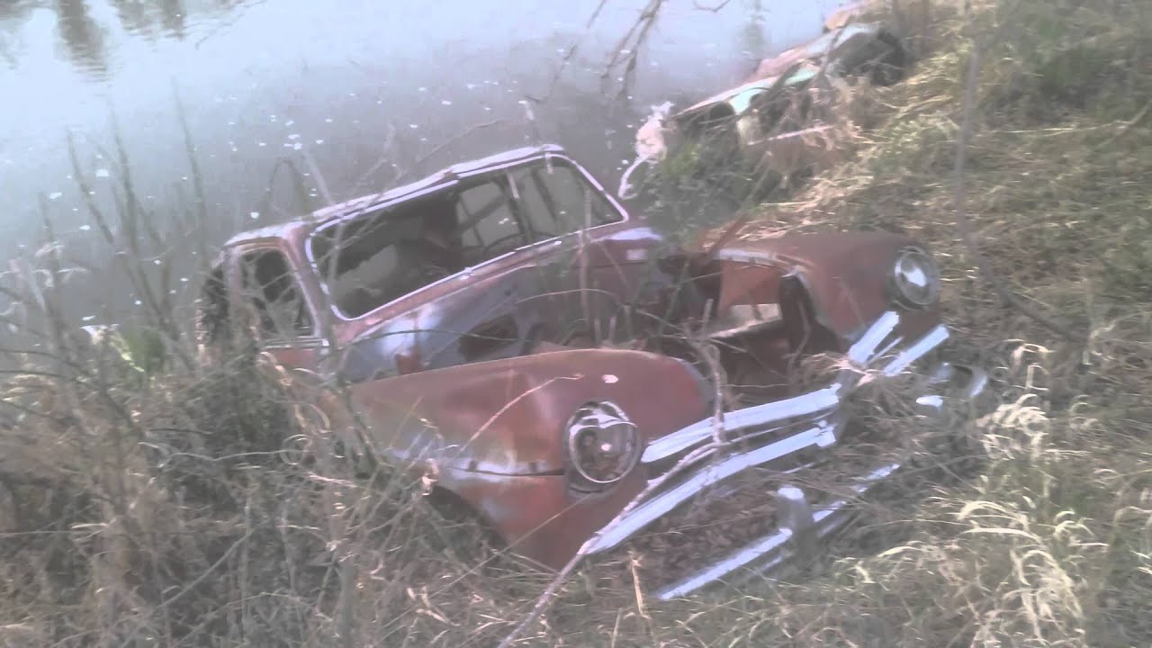 Old cars rotting away on river bank pt1 - YouTube