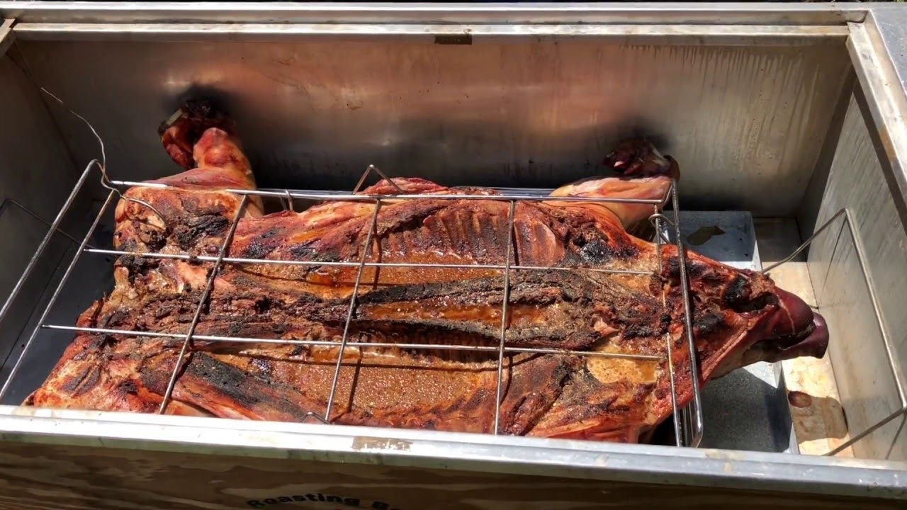 Roasting a Pig Cuban Style with a La Caja China - YouTube