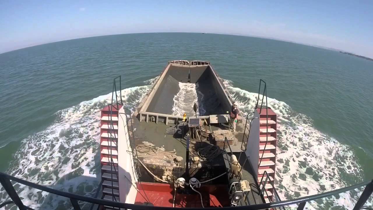 Dumping a mud scow - YouTube