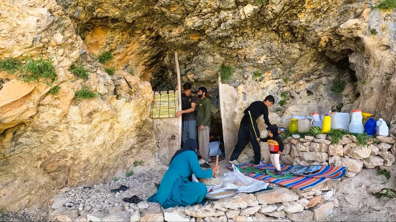 Traditional cave building and family gathering to build a window and ...