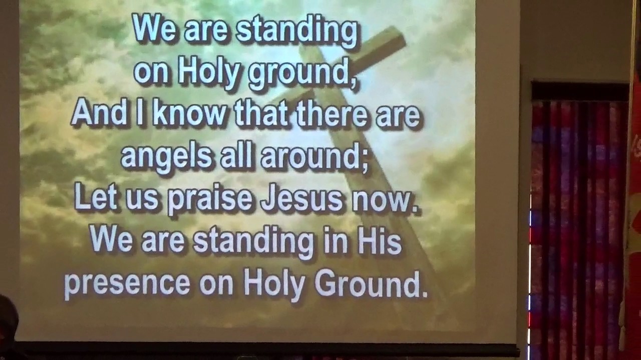 We Are Standing In His Presence On Holy Ground Lyrics