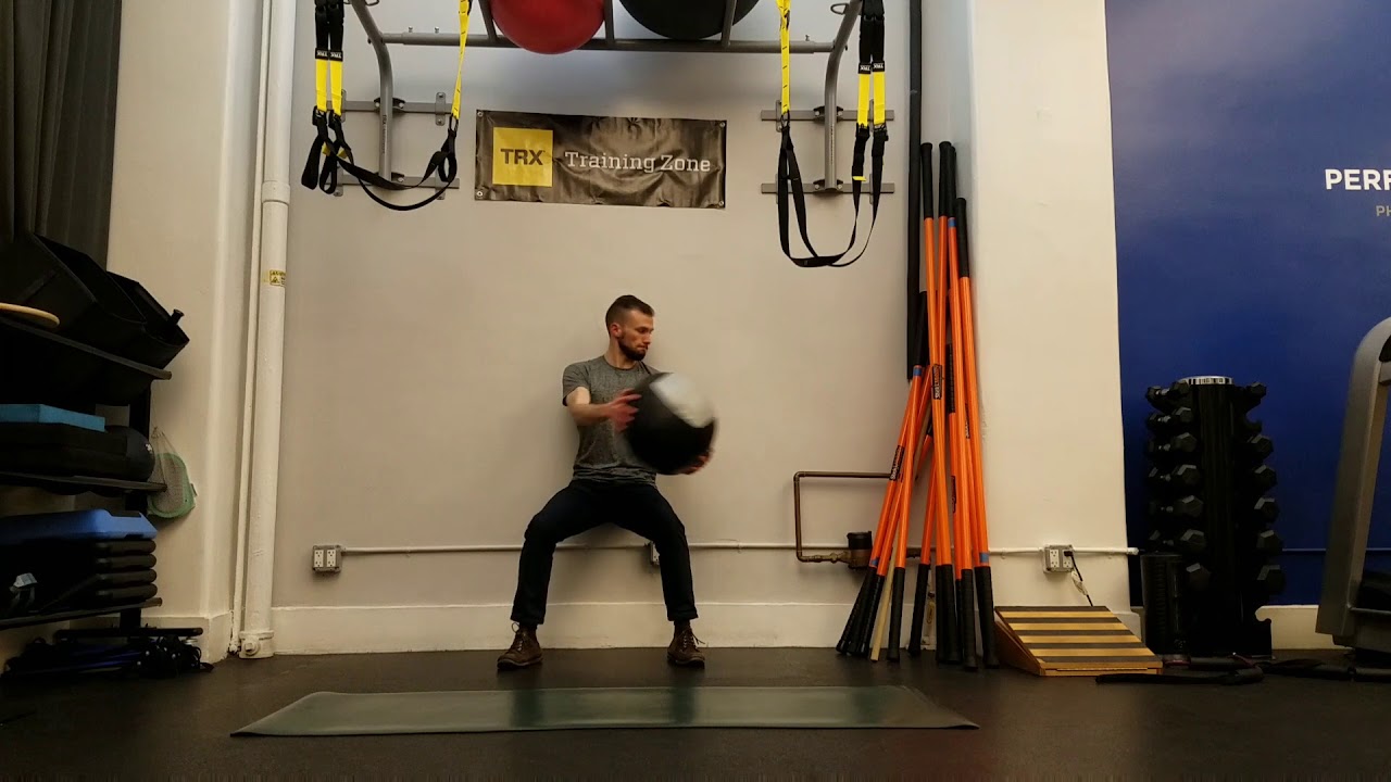 Wall Sit + Med Ball Rotations - YouTube