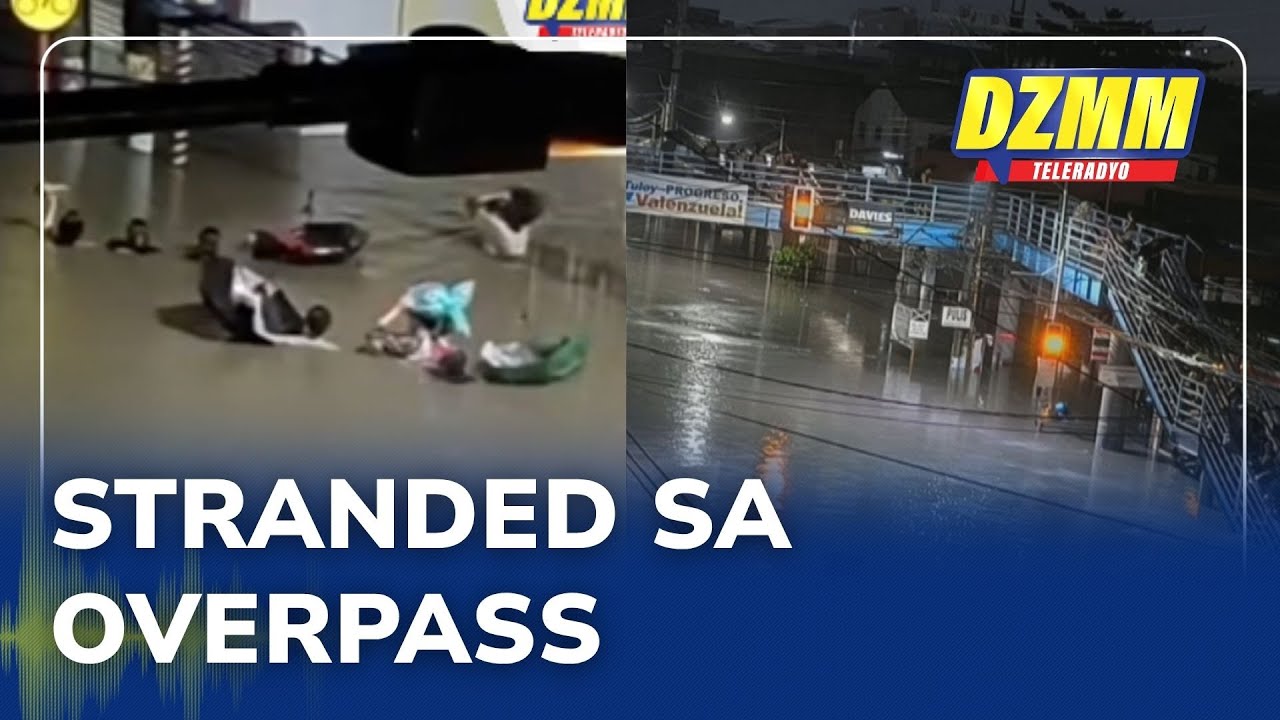 Residents stranded on overpass in Valenzuela due to chest-deep floods ...