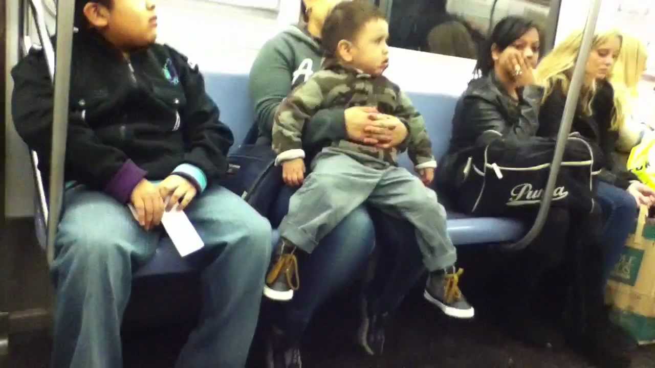 Scared Baby looks at death metal rocker on train - YouTube