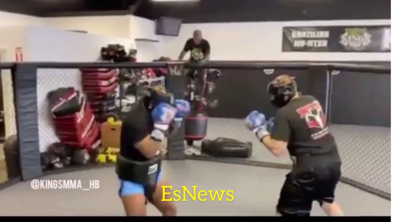 Mike Tyson sparring mike russell in a MMA Cage - YouTube