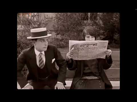 Buster Keaton asks girl reading \