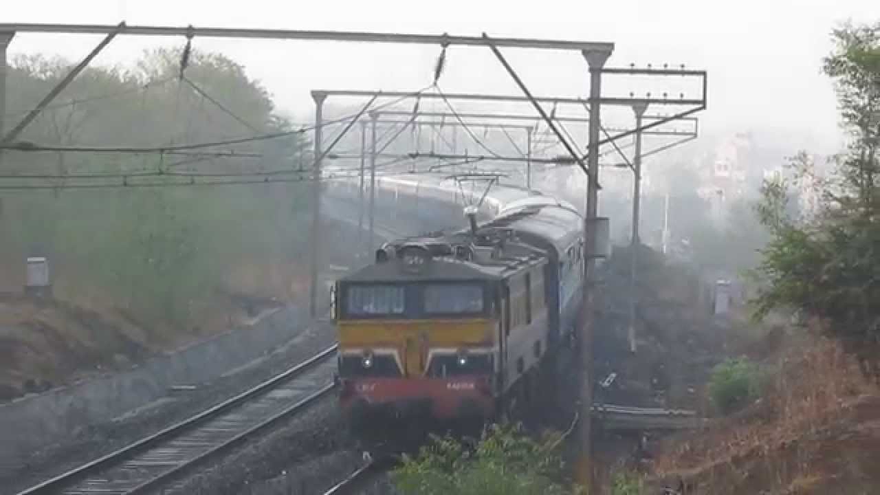 First train of the day between Pune Mumbai Sinhagad Express curving ...