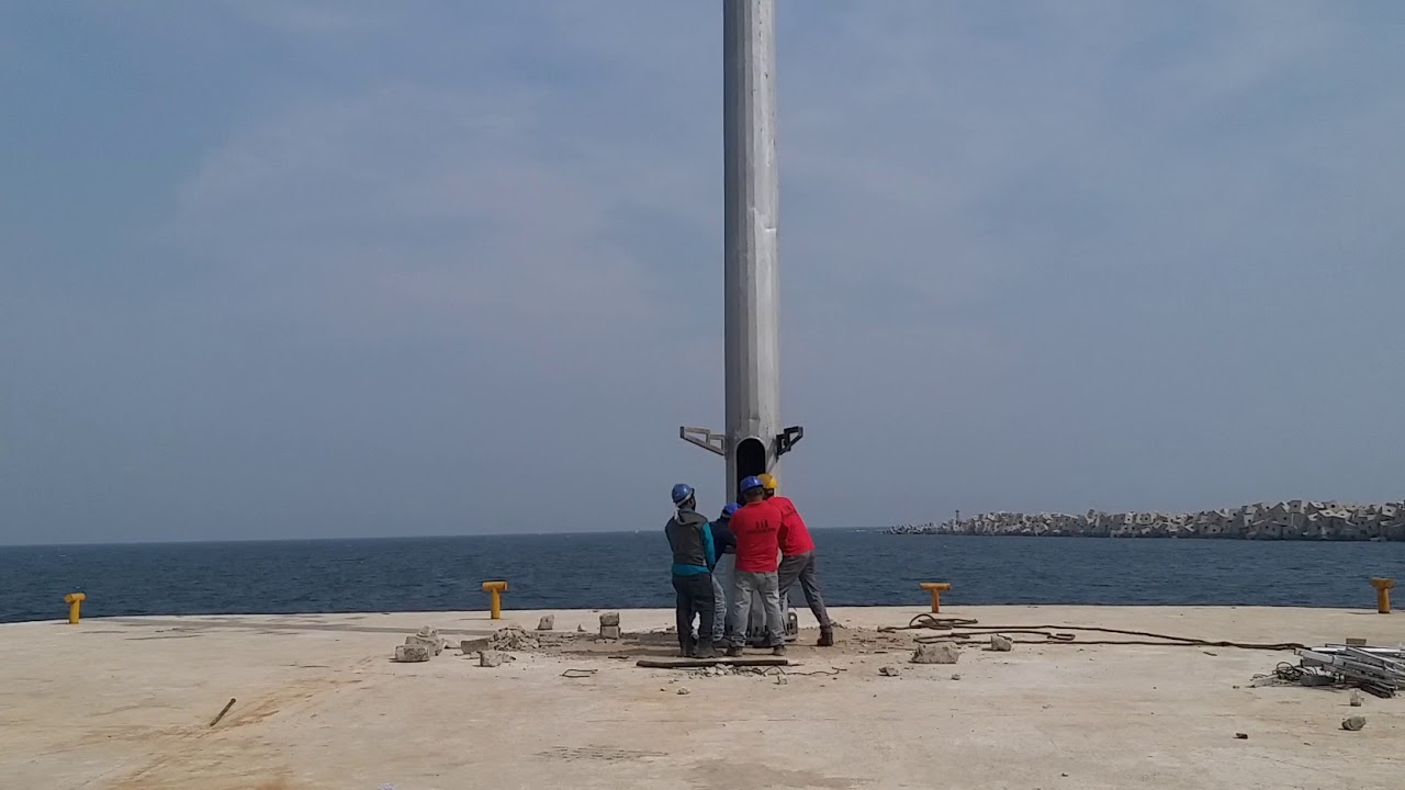High mast lantern carriage lifting manually sea shore center area - YouTube