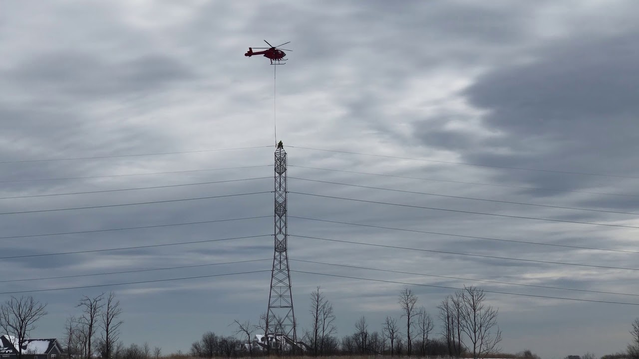 Helicopter Lowering Men onto High-Tension Power Lines - YouTube