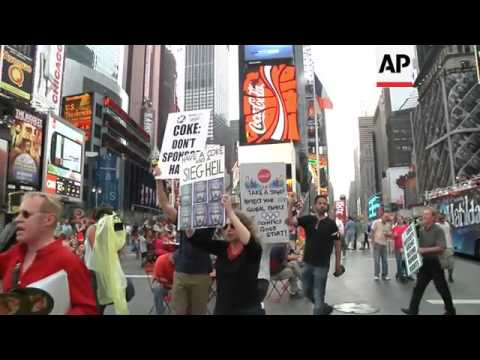 Coke dumped in Times Square to protest Coca-Cola's sponsorship of 2014 ...