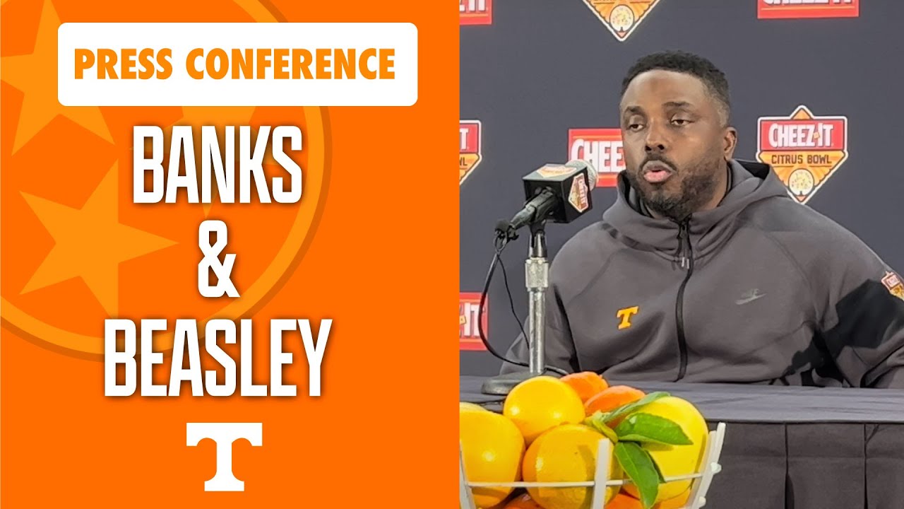 Tim Banks and Aaron Beasley talk during coordinators press conference ...