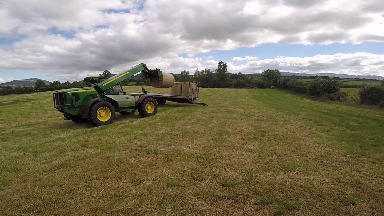 LOADING HAY BALES - YouTube