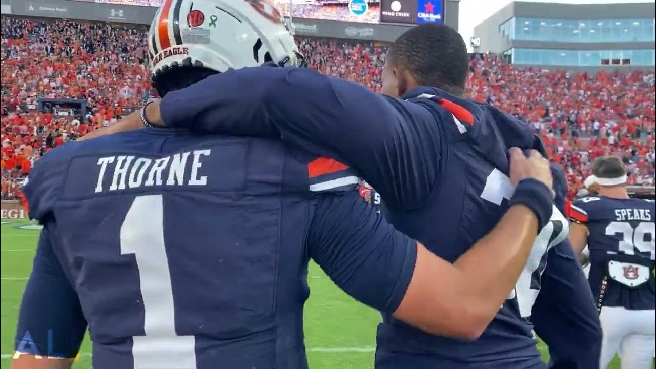 Hugh Freeze and Payton Thorne walk off the field follow Auburn's hard-fought battle with Georgia ...