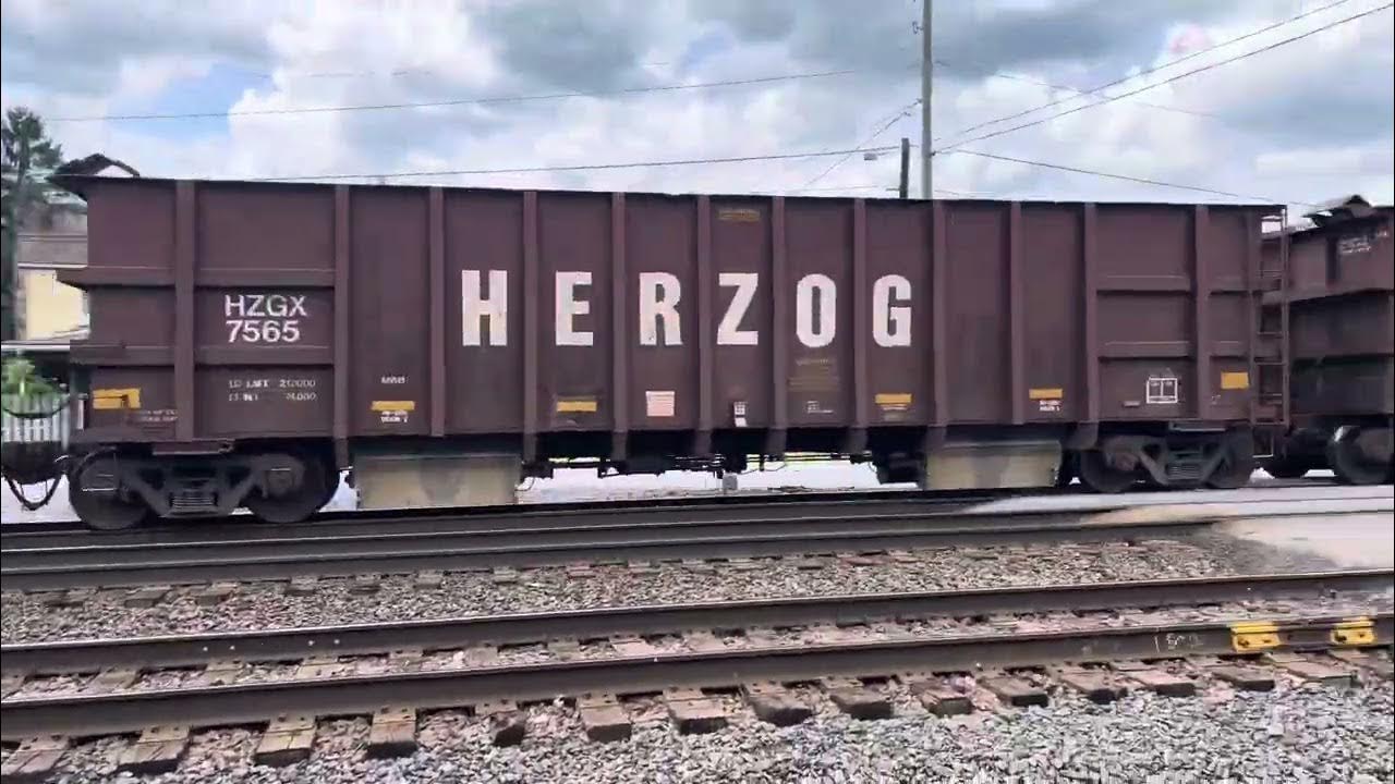 Herzog ballast train with freshly painted AC44C6M - YouTube