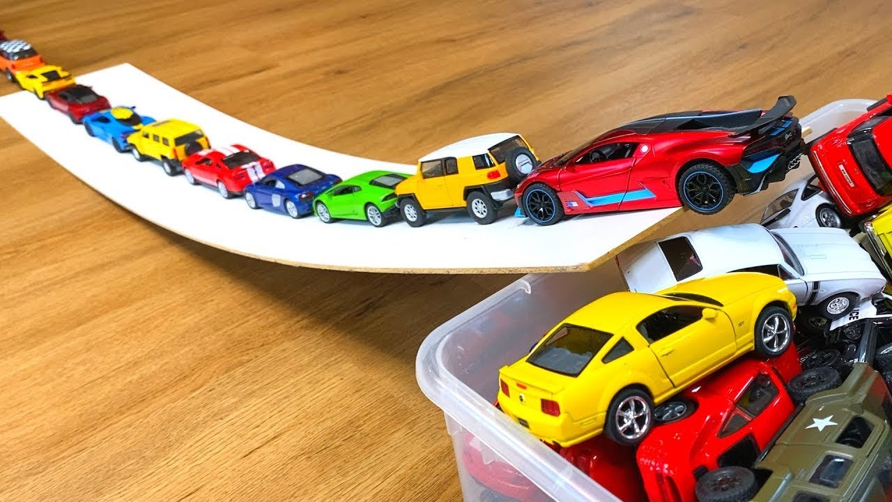 Various Diecast Model Cars Moving Down On Slider. Slope driving test ...