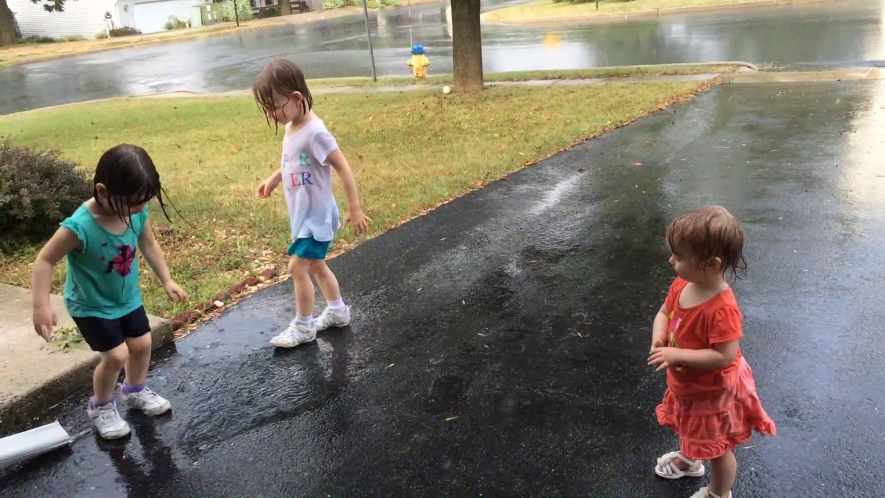 Playing in the rain after getting soaked during our walk - YouTube