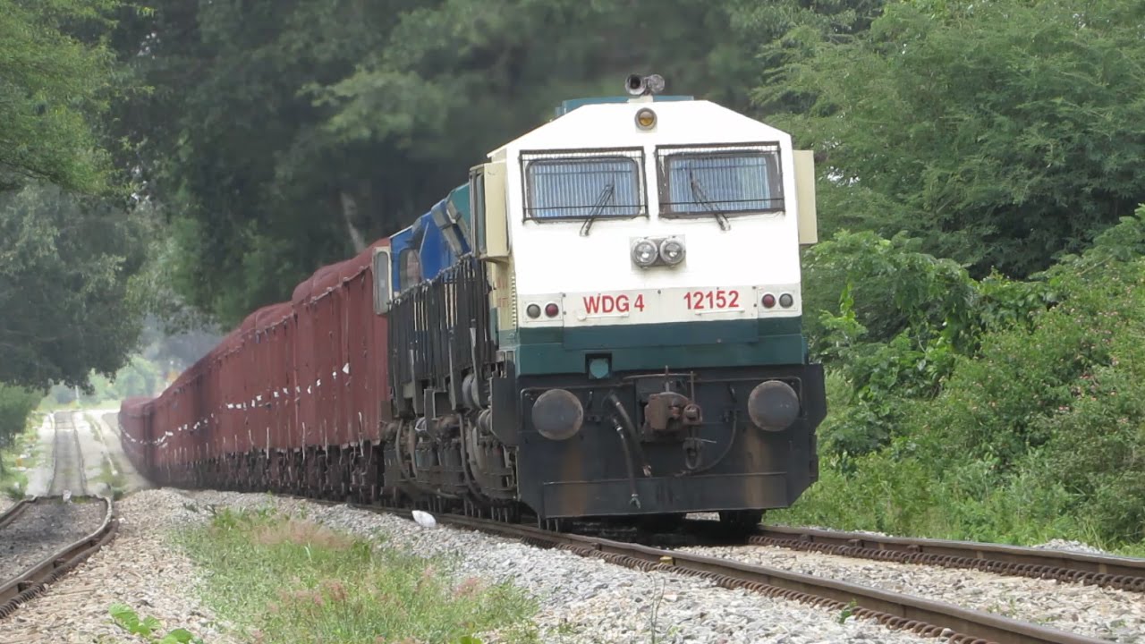 Twin EMD climb a slight gradient with BCNA rake on tow - Indian ...