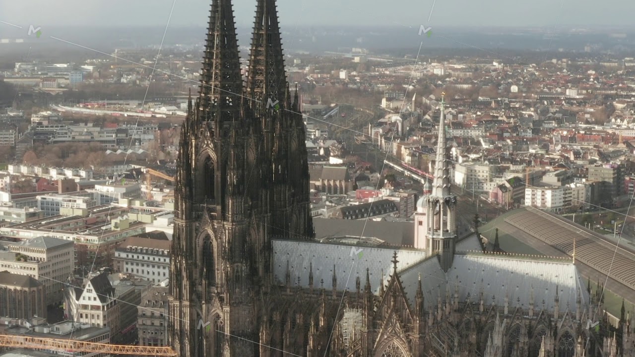 AERIAL: Circling around Beautiful Cologne Cathedral with Central Train ...