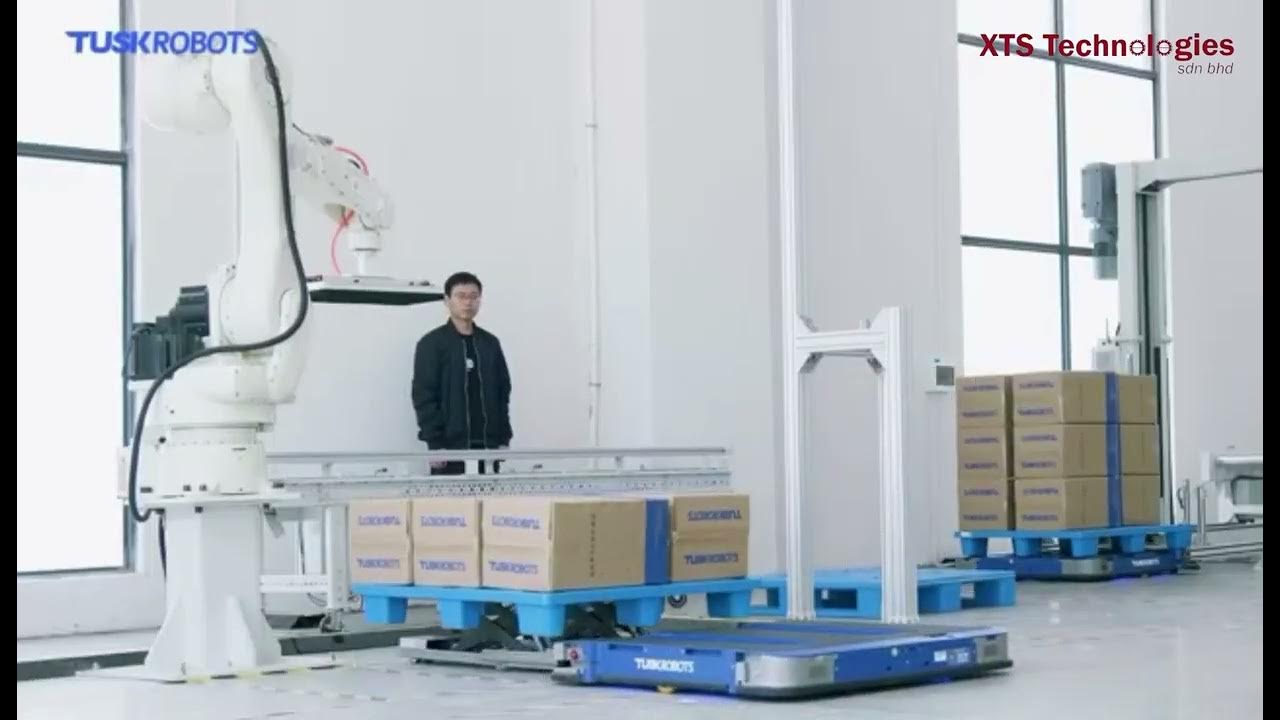 Pallet AGV or AGF Tusk robotics pallet robot handling automation with conveyor and lift ...