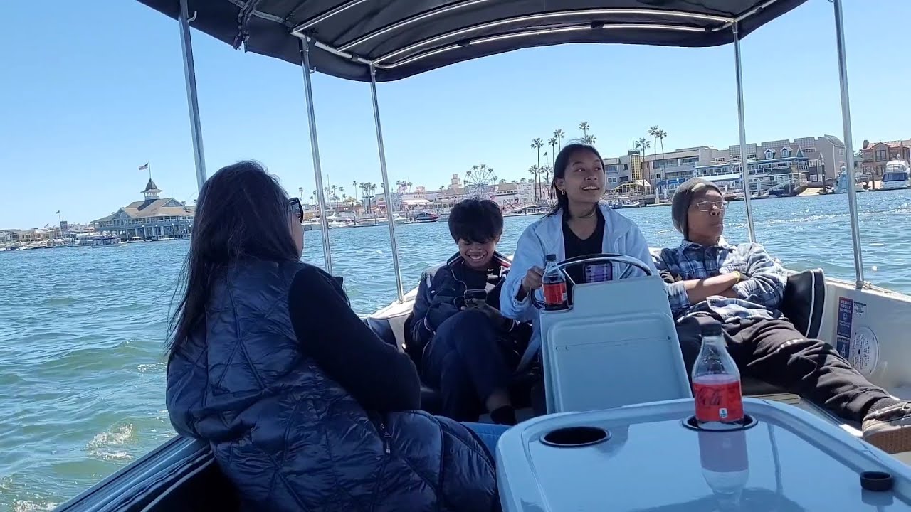 Relaxing family boat cruise at Balboa Island in Newport Beach ...