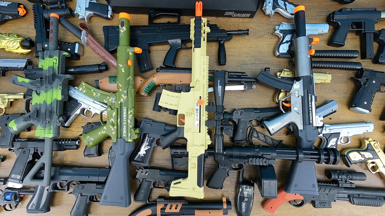 Box of Toy Guns and Pistols, Realistic Rifles, Special Equipment, and ...