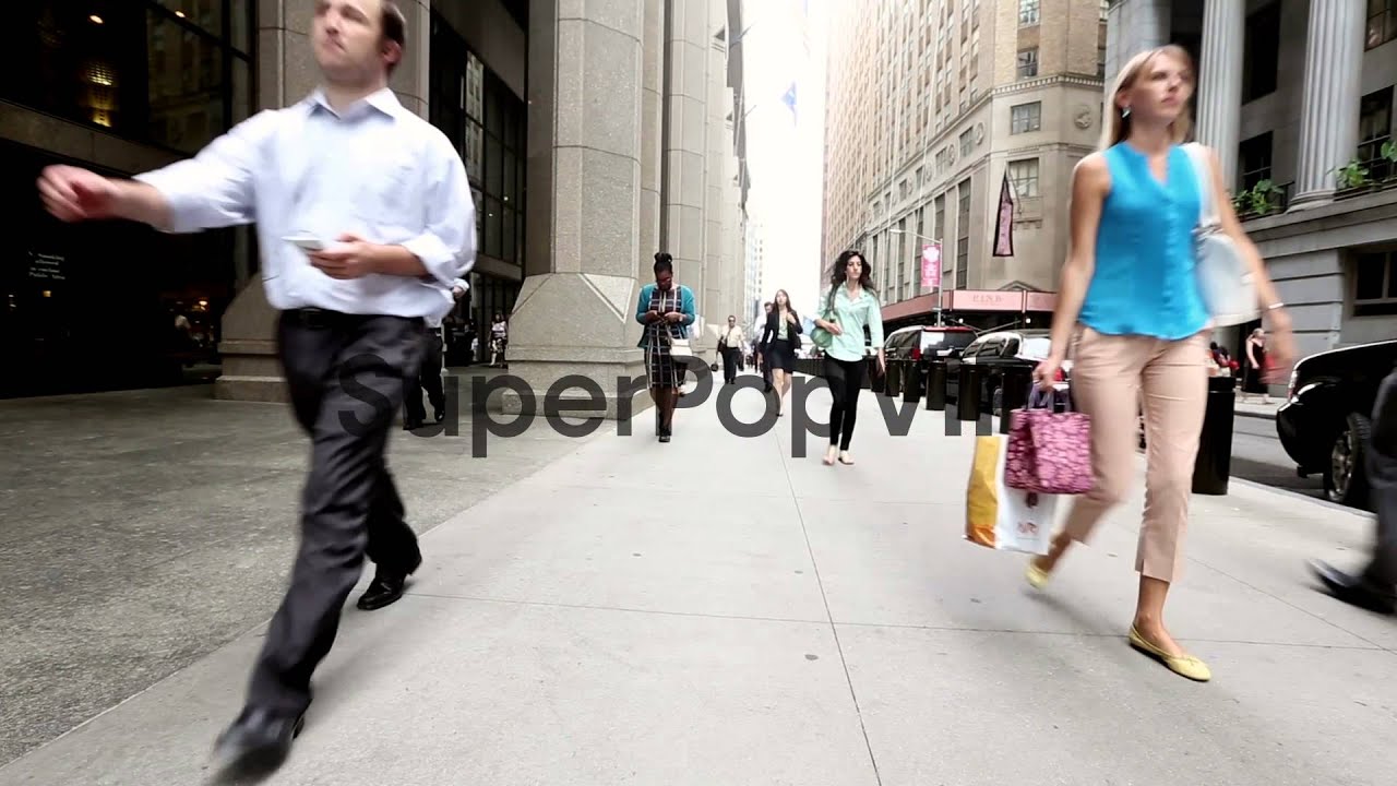 Long crowd shot. People pass through the iconic Wall Stre... - YouTube