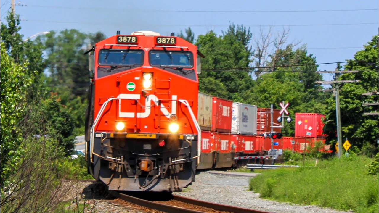 CN120 gets lead by four ES44AC units through Windsor Junction - YouTube
