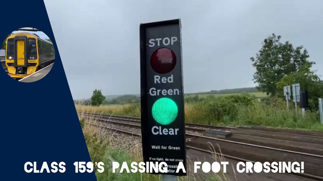 Class 159’s passing a level crossing near Sherborne! - YouTube