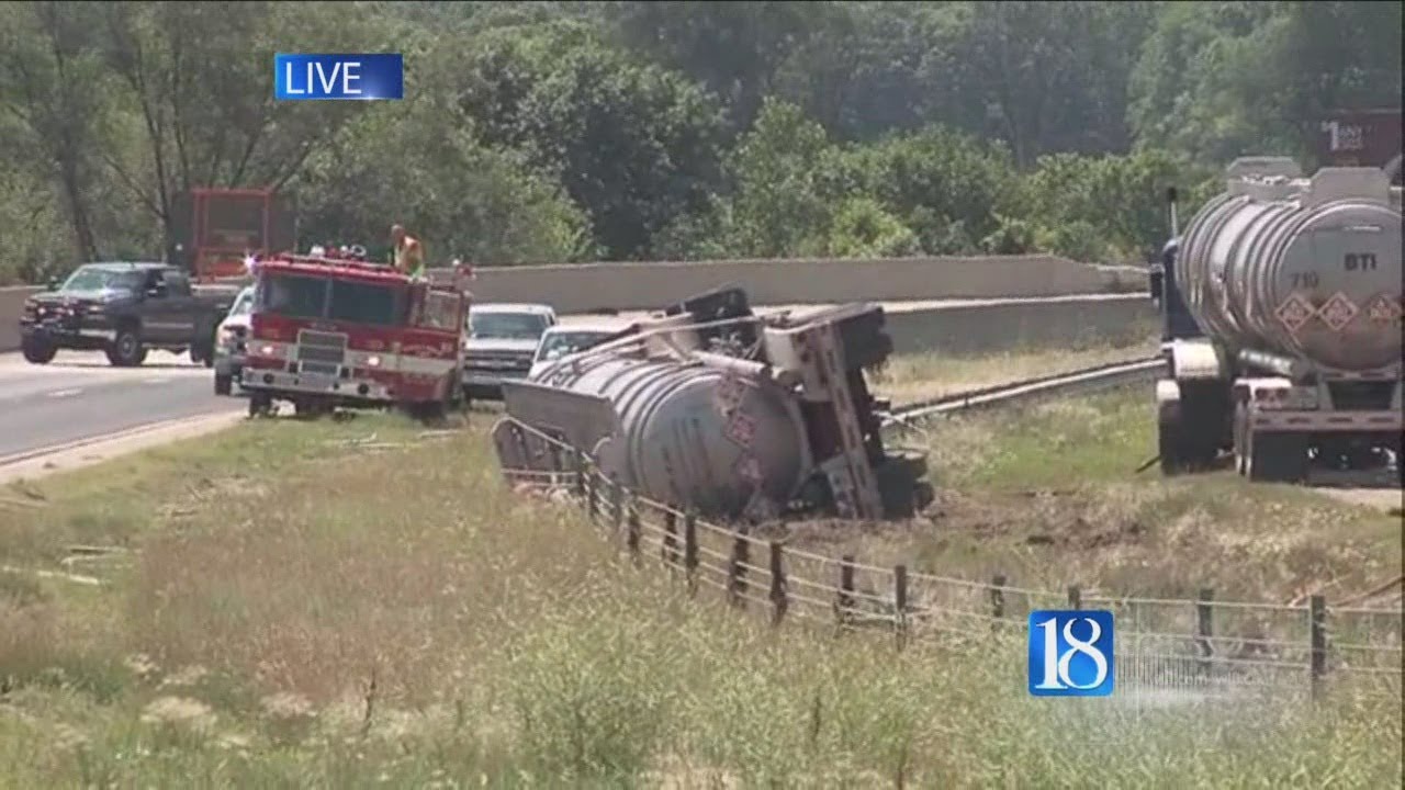 Semi tanker rolls over on I-65 - YouTube