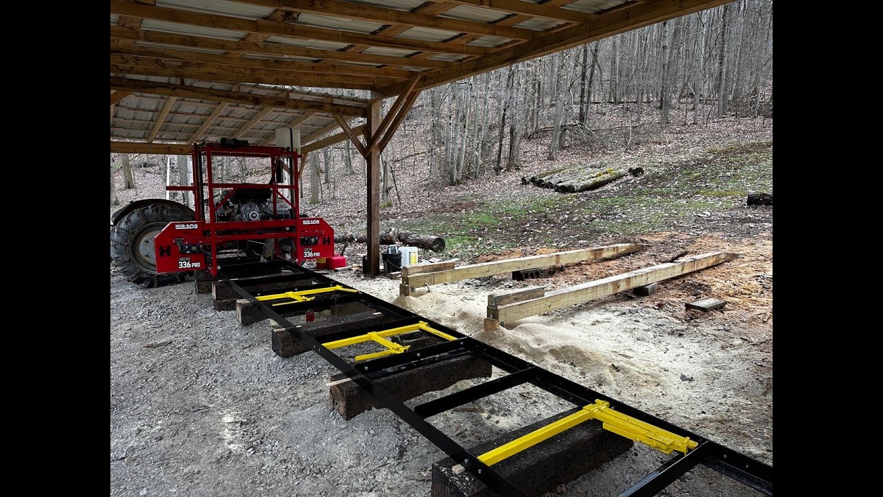 Spreading gravel and setting up sawmill - YouTube