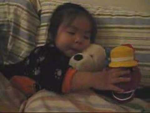 Baby Monica likes her plush puppy