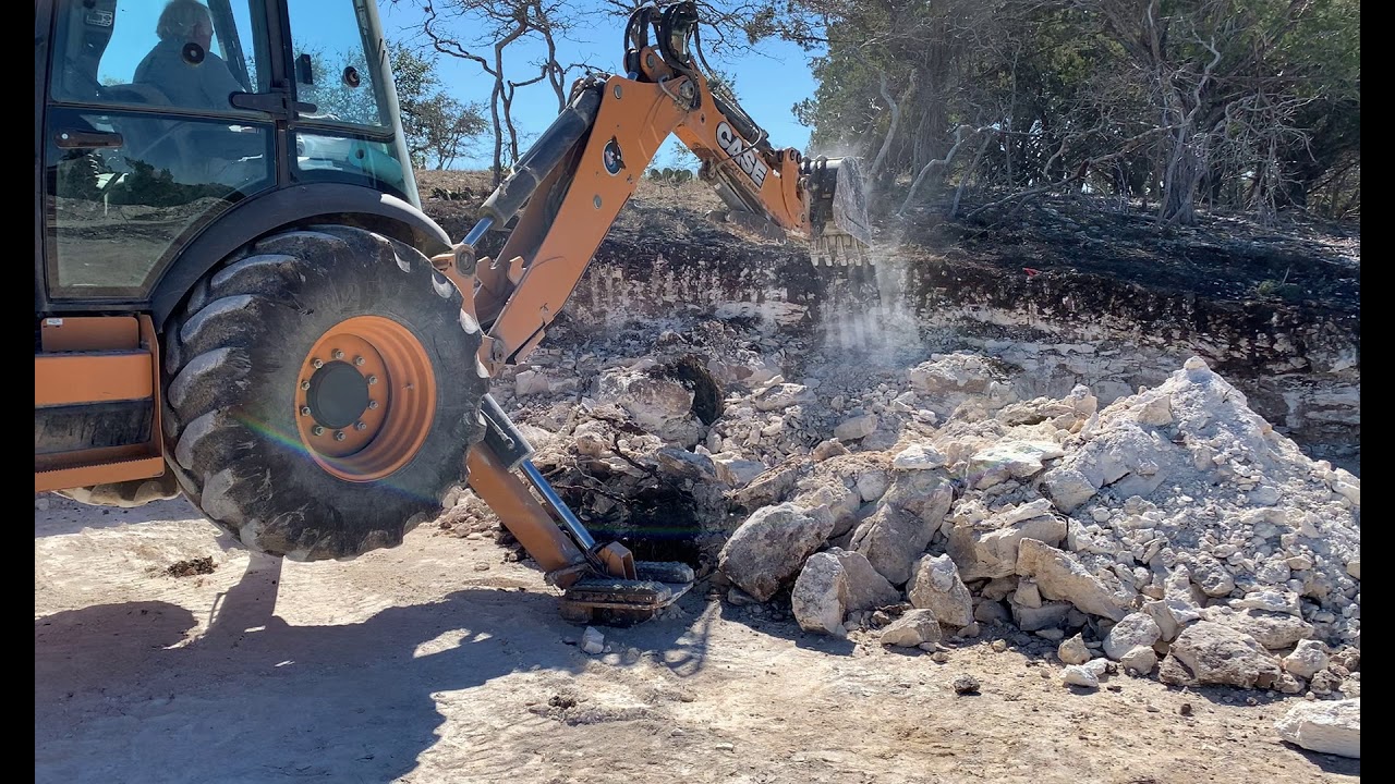 Limestone Excavation With A Case 590 Backhoe - YouTube