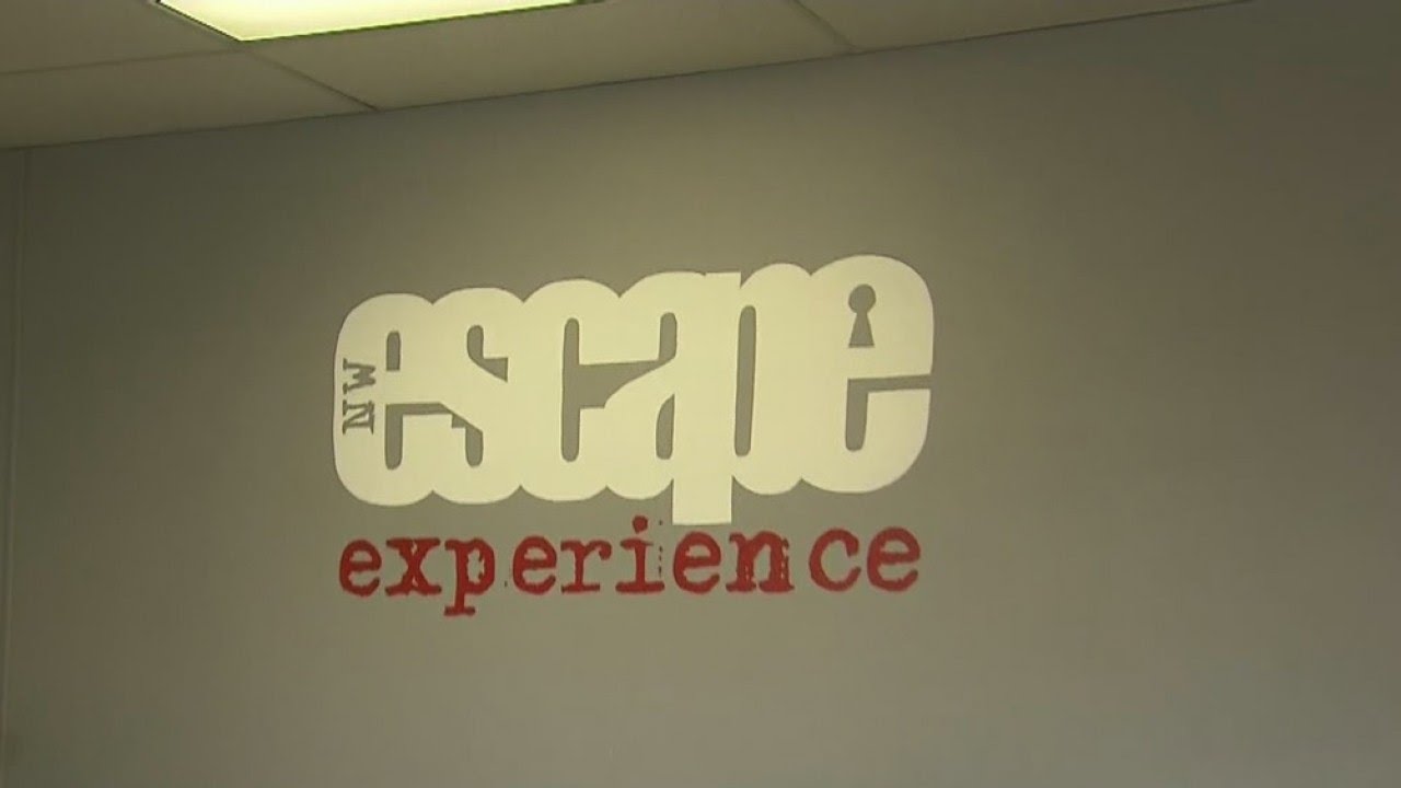Burglar can't get out of escape room, calls 911 - YouTube