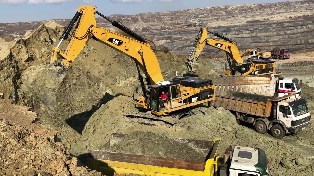 Caterpillar 375 & Caterpillar 385C Excavators Loading Trucks ...