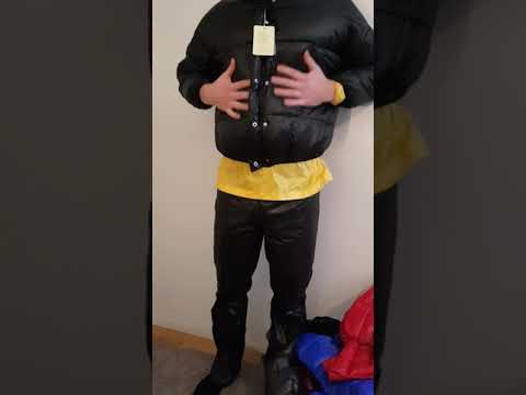 Downjacket black try on while wearing shiny nylon clothes.