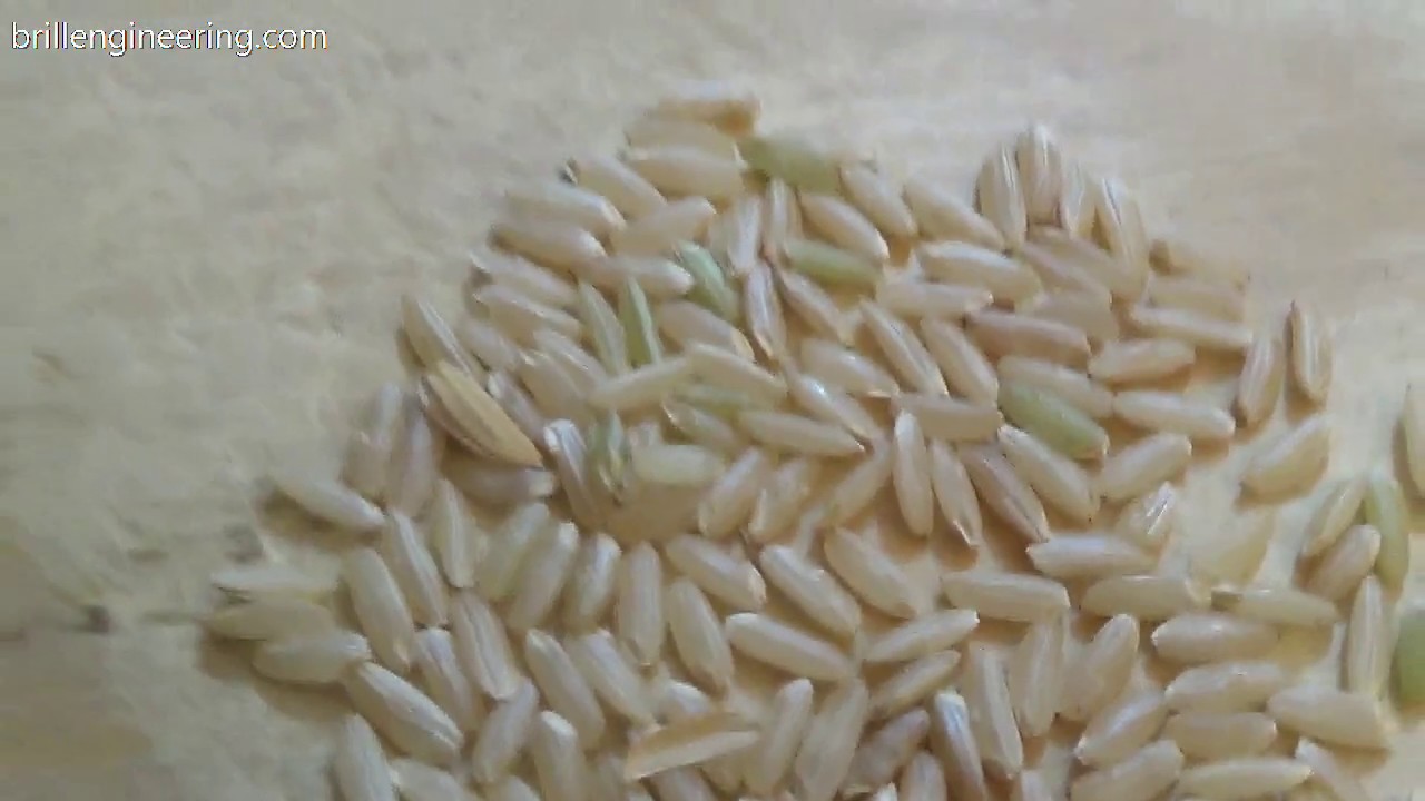 de-hulling rice between wood pieces brillengineering.com - YouTube