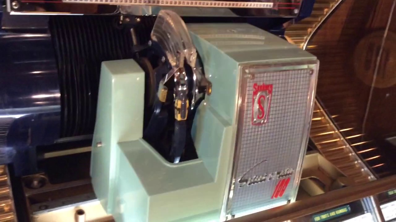 Seeburg R jukebox detailed view of front and sides and playing records ...