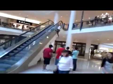 Falling off an escalator - YouTube
