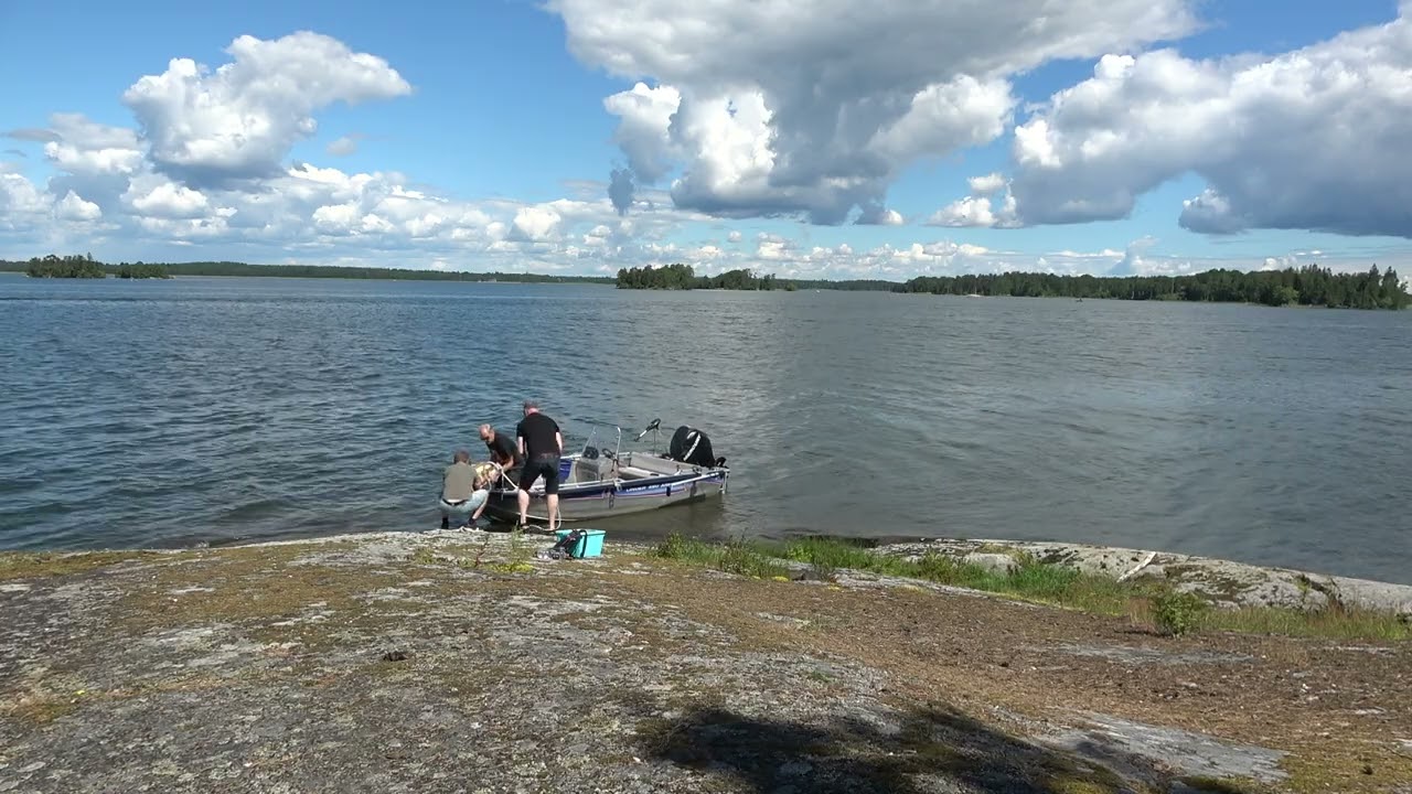 Green Screen Background delivers a totem pole by boat to a small island ...