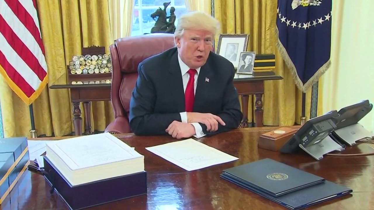 Donald Trump signs tax, government spending Bills into law - YouTube