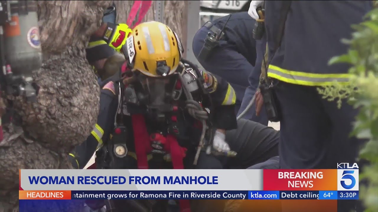 First responders pull woman rescue woman trapped down manhole in O.C ...