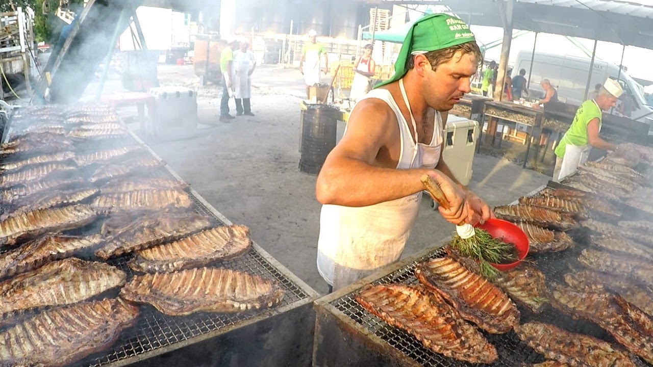 Grilling Team Cook Tons of Ribs and Meat at the Italian Ribs Street ...