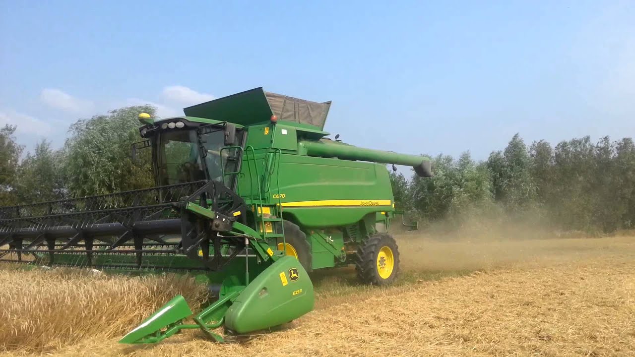John Deere C670 + John Deere 6140R - YouTube