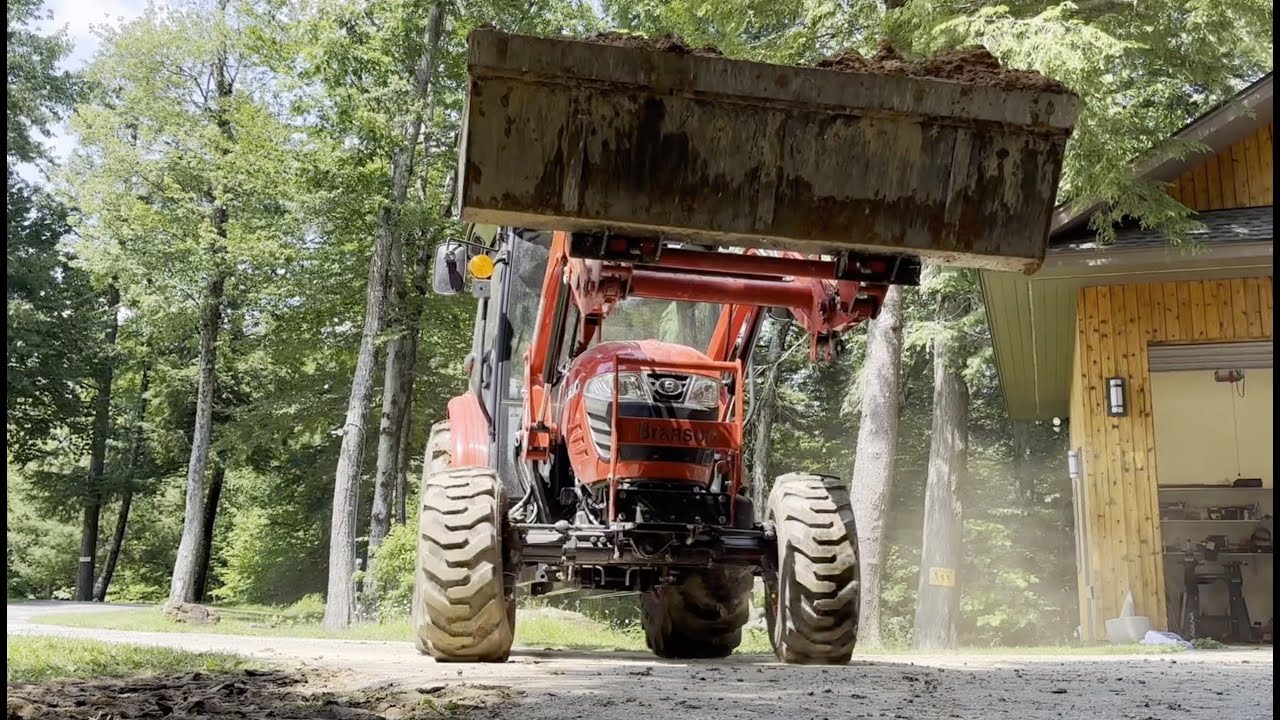 Excavating & Moving Rocky Soil with a Tractor - YouTube
